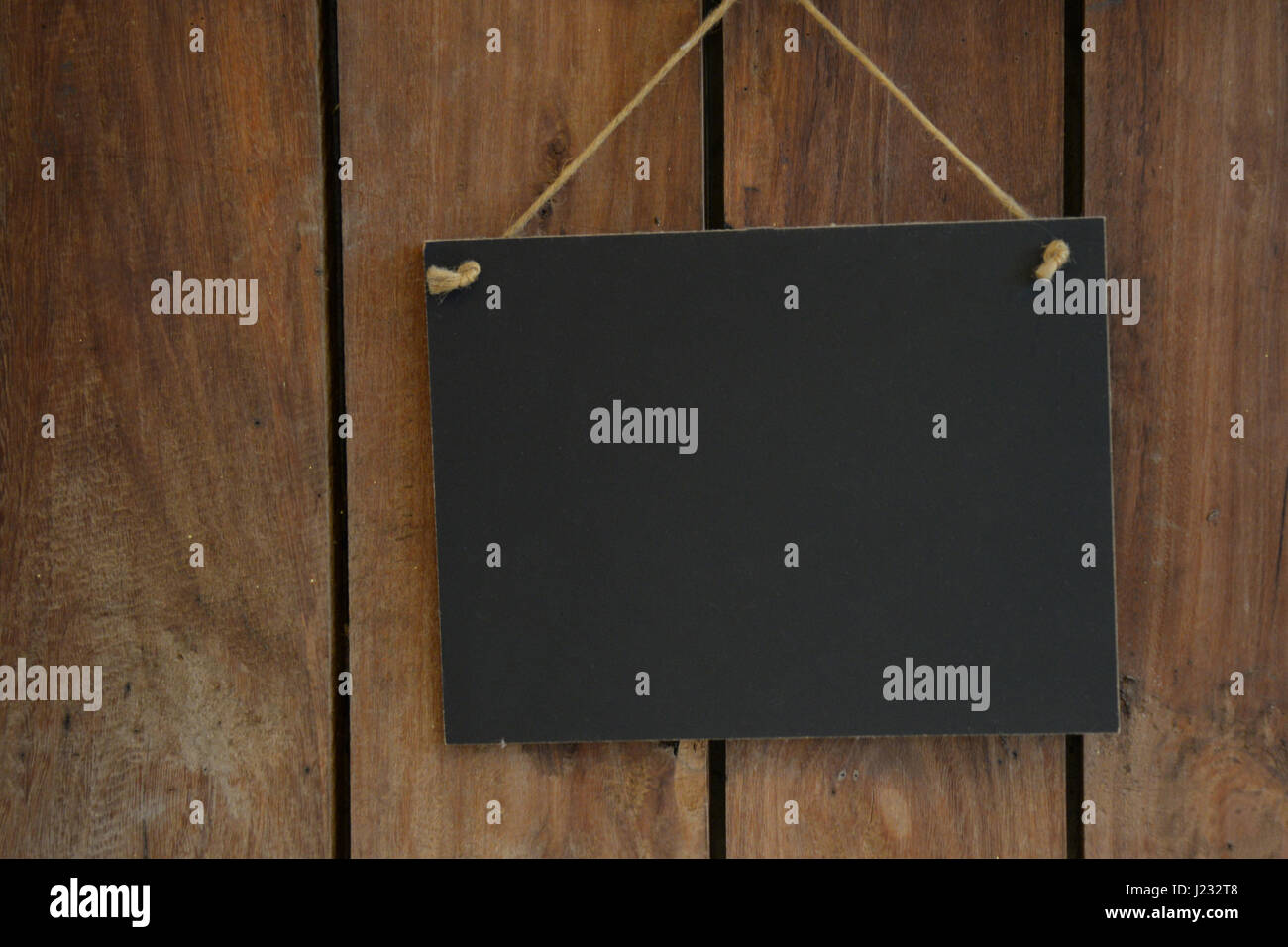 Blackboard sign on wooden background with copy space for advertising ...