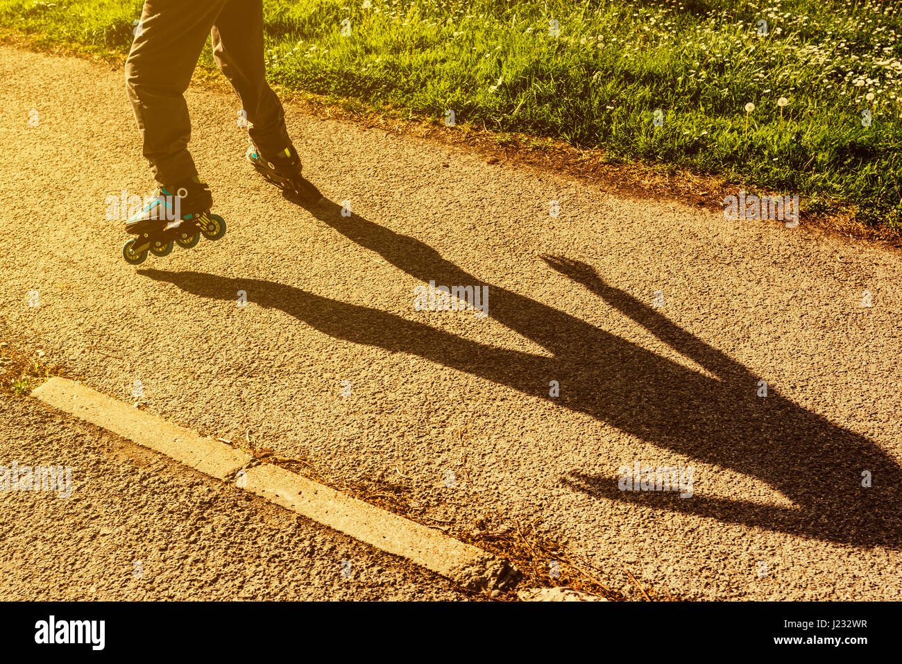 Boy riding roller blades on the street. Young unrecognizable child ...