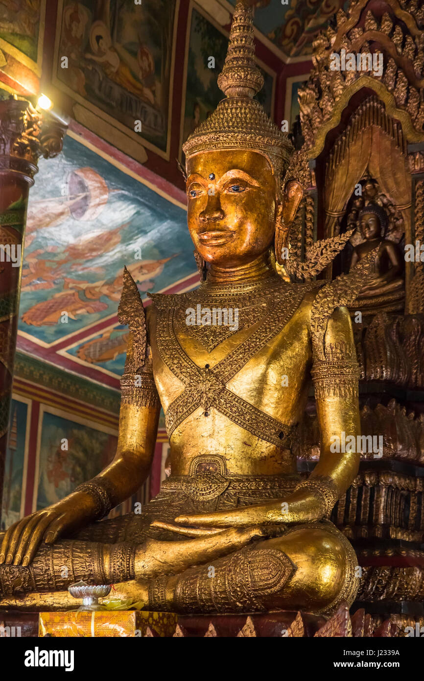Golden statue Buddha at Buddhist monastery Wat Phnom, Phnom Penh ...