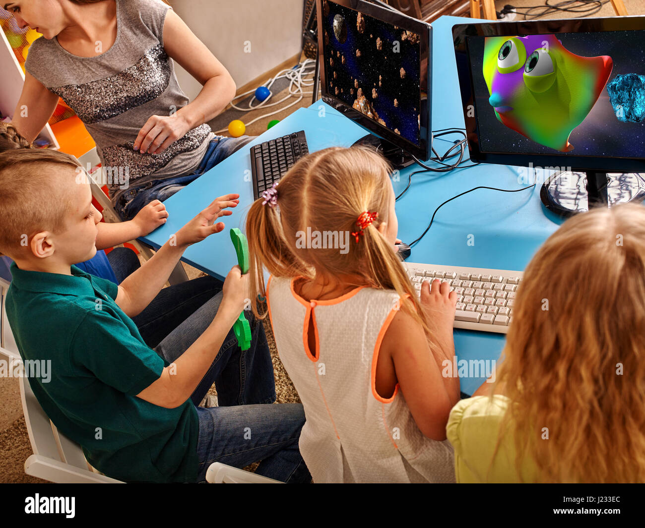 Children computer class us for education and video game Stock Photo - Alamy