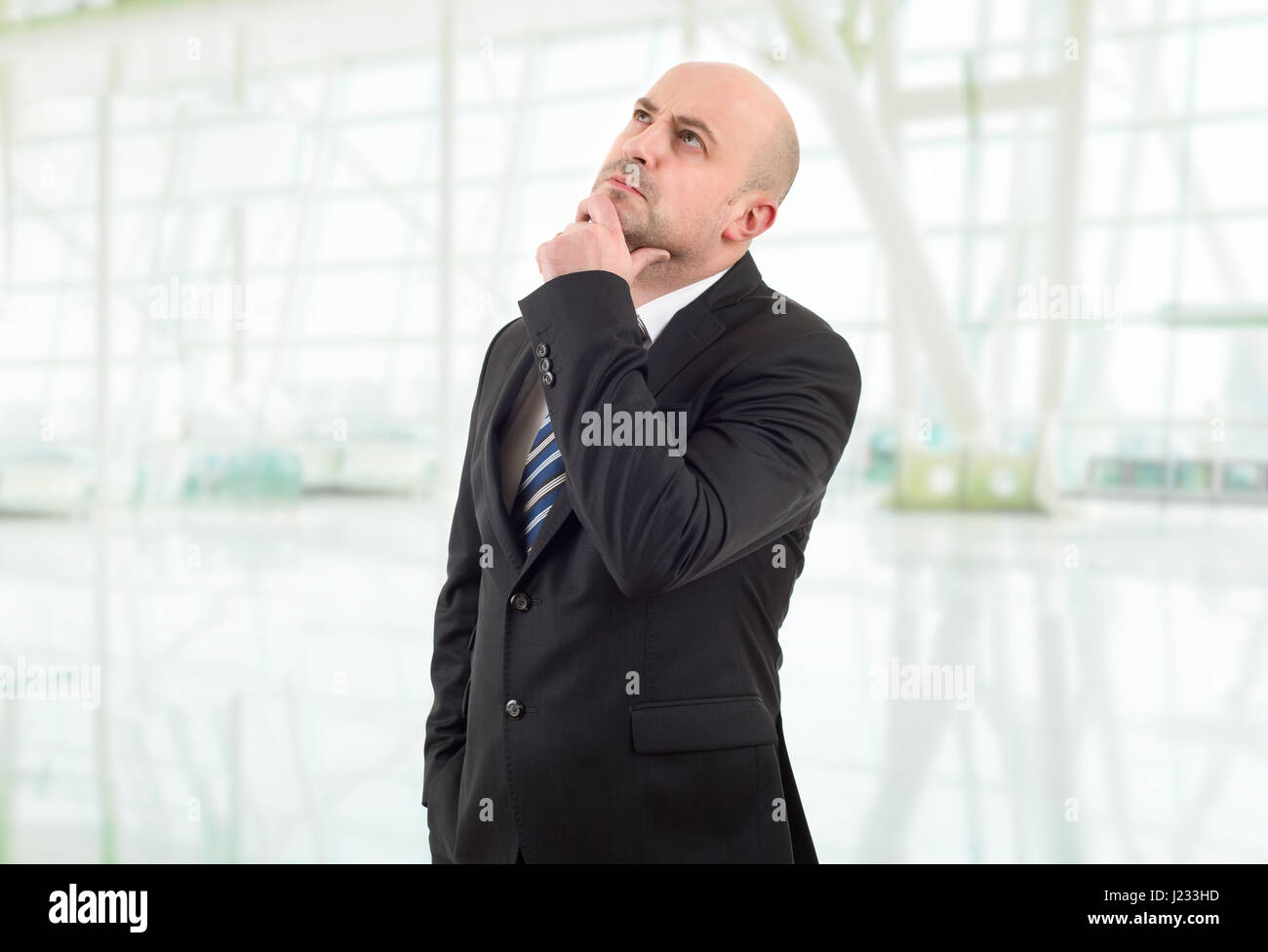young business man thinking, at the office Stock Photo - Alamy