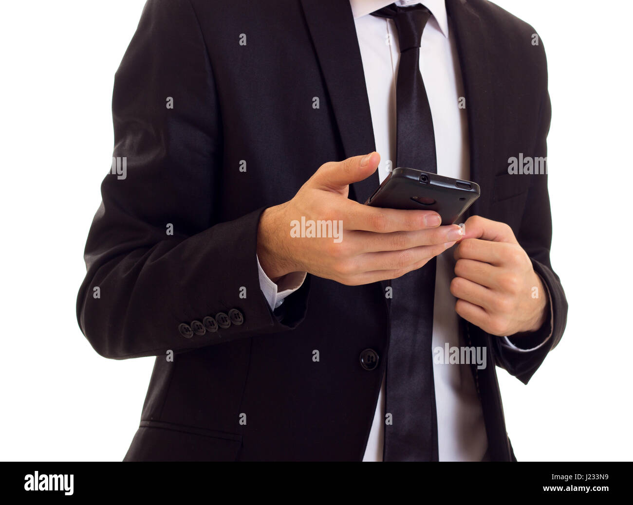 Young man in suit talking on the phone Stock Photo - Alamy