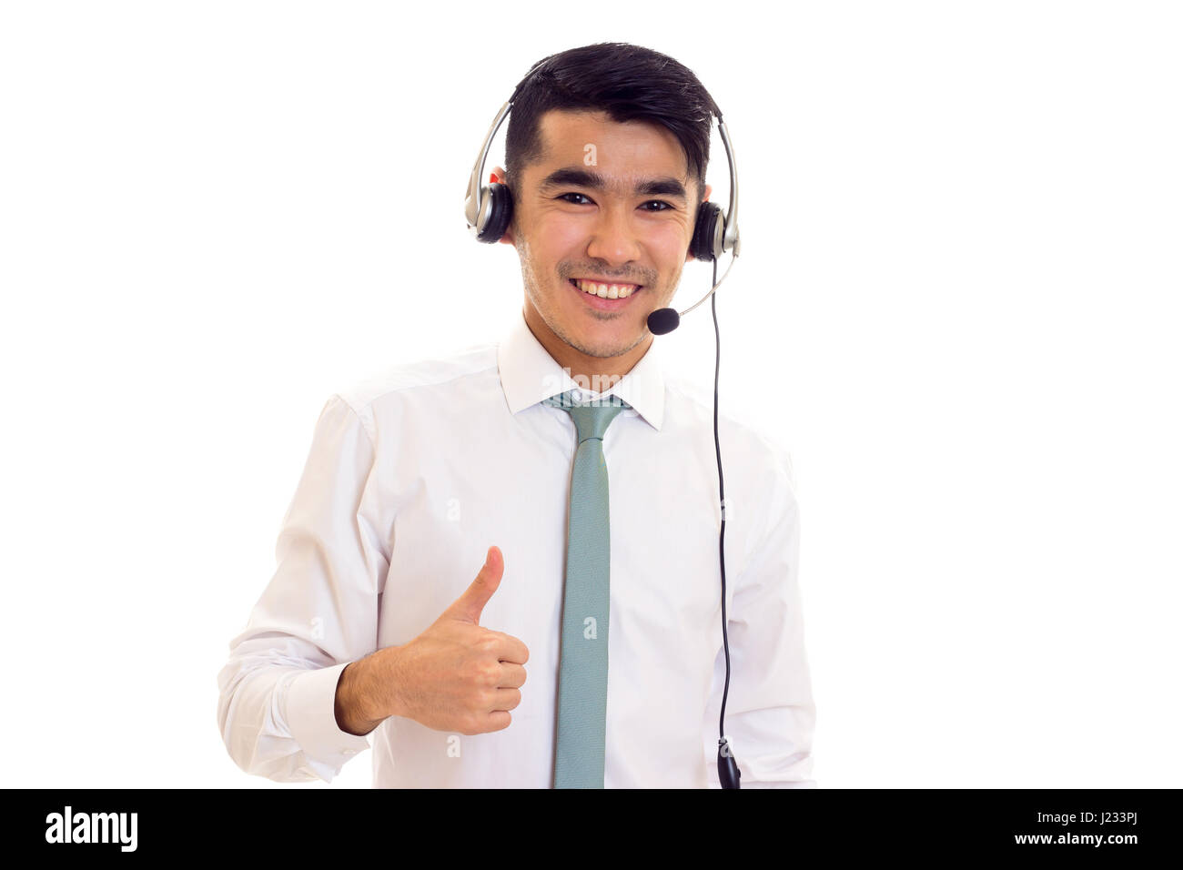Young man using headphones Stock Photo - Alamy