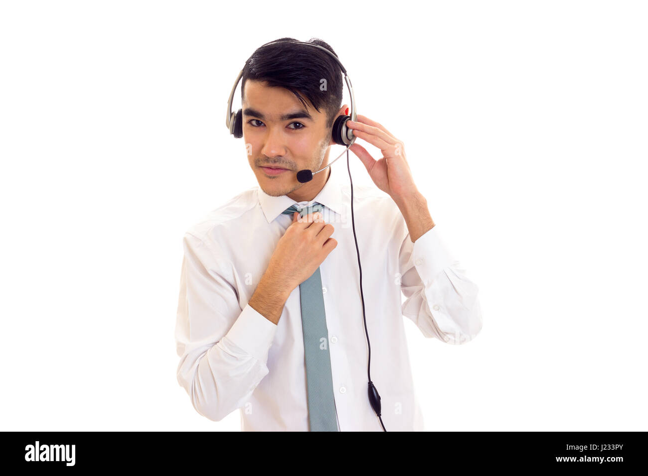 Young man using headphones Stock Photo - Alamy