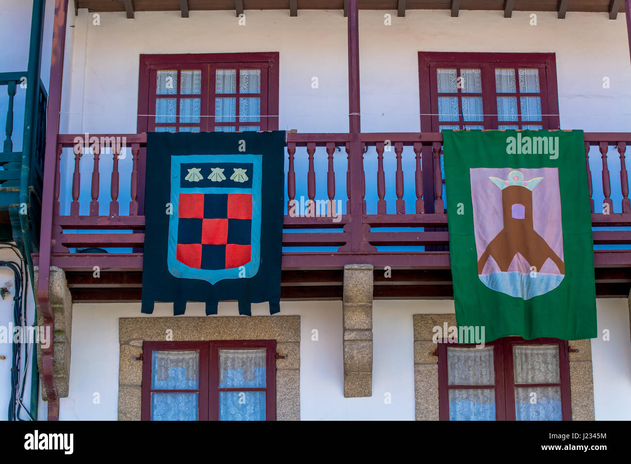 View of old House Facade with Medieval Flags Stock Photo - Alamy