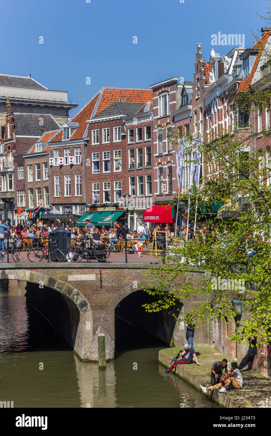People enjoying the sun at the canals of Utrecht, Holland Stock Photo ...