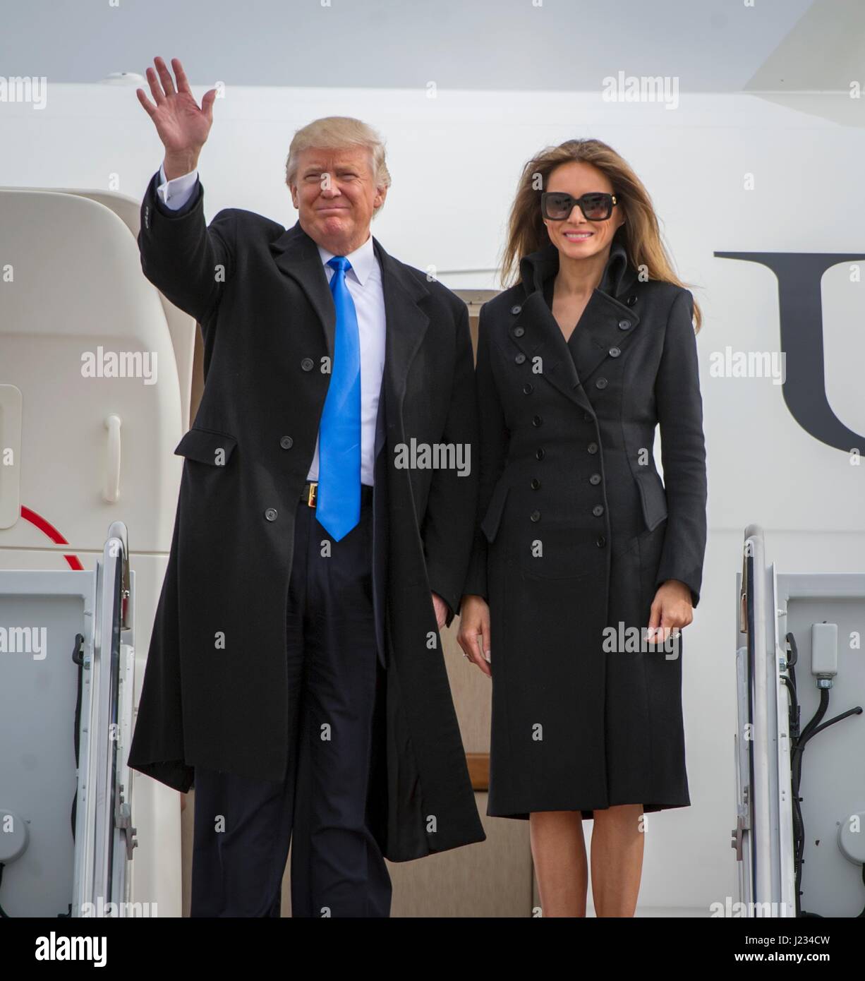 U.S. President-elect Donald Trump and wife Melania Trump wave to a ...