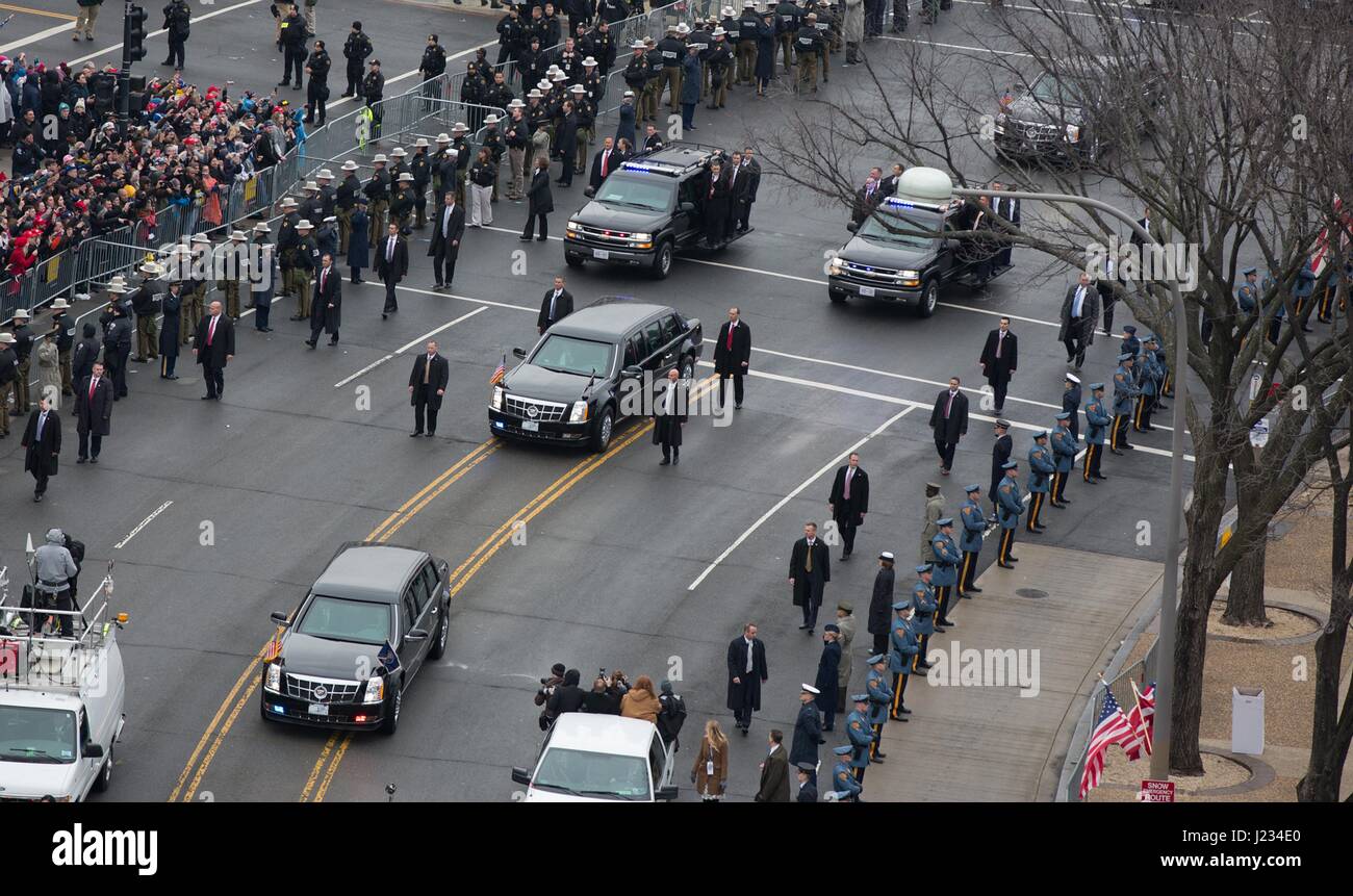 U.S. soldiers salute U.S. President Donald Trump as he passes by in the ...