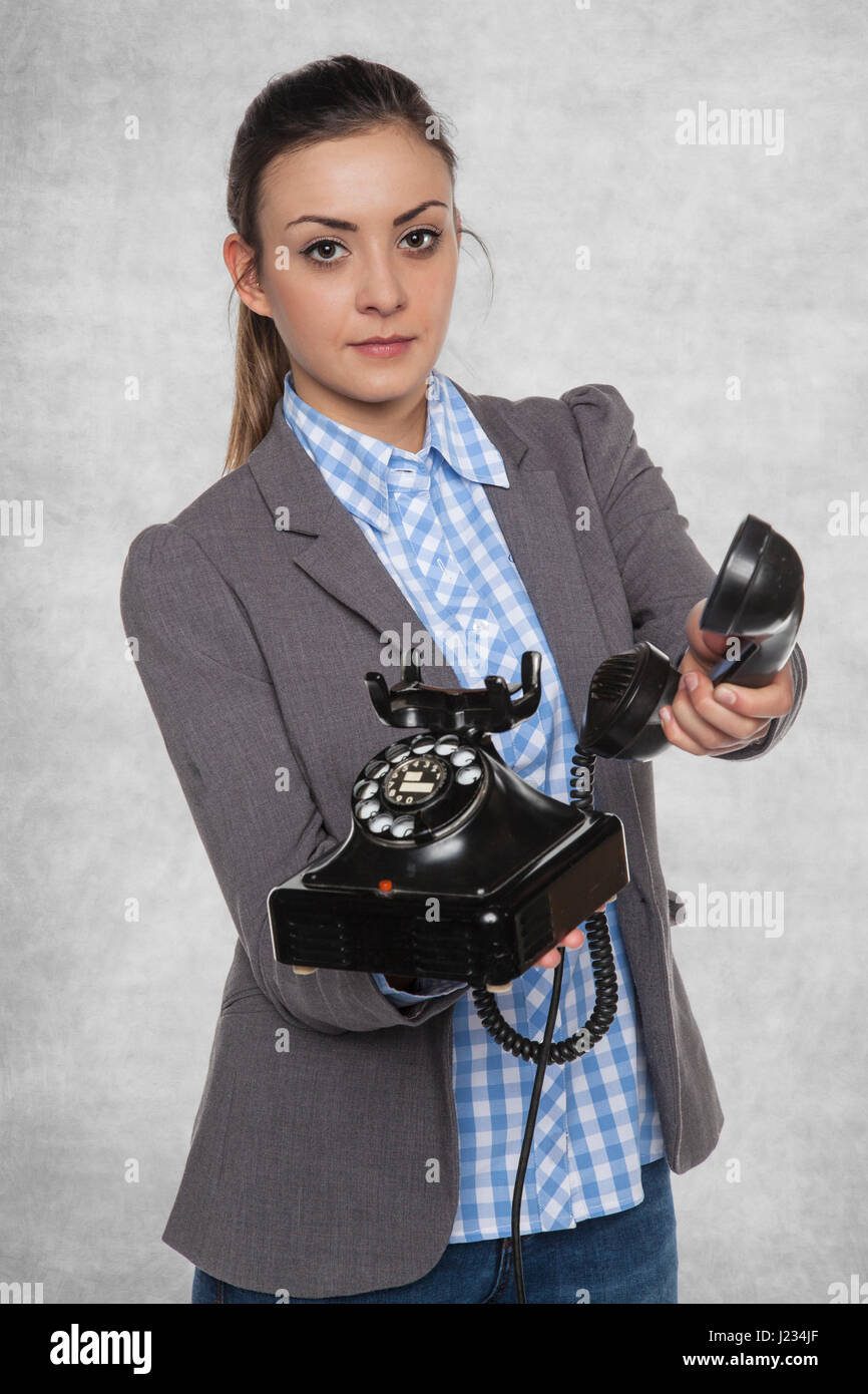 Business woman giving phone to you Stock Photo - Alamy