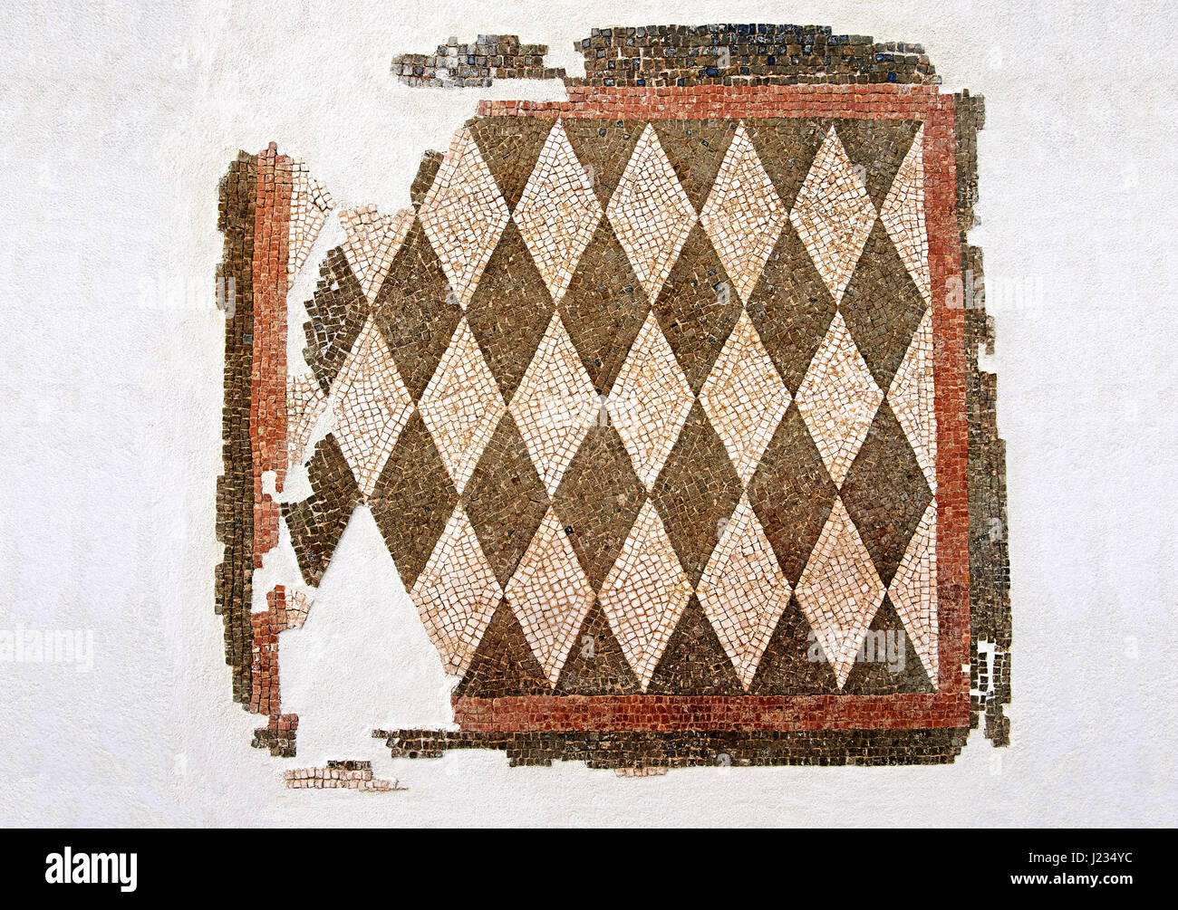 Roman geometric floor mosaic with black and white diamonds shapes. From ...
