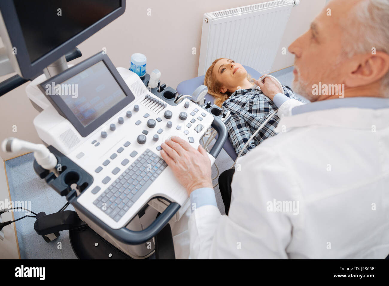 Qualified doctor providing ultrasound scanning in the hospital Stock ...