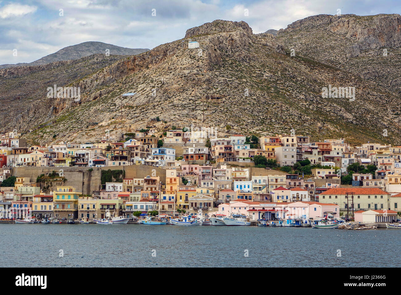 Italian style houses and fishing boats, Pothia, Kalymnos, Greece Stock ...