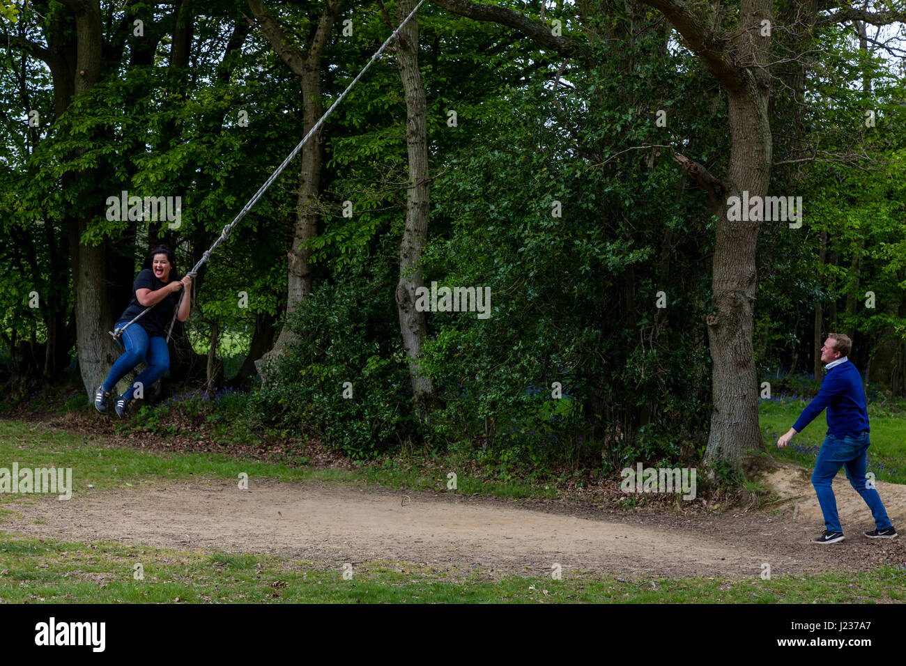 Girl being pushed swing happy hi-res stock photography and images - Alamy