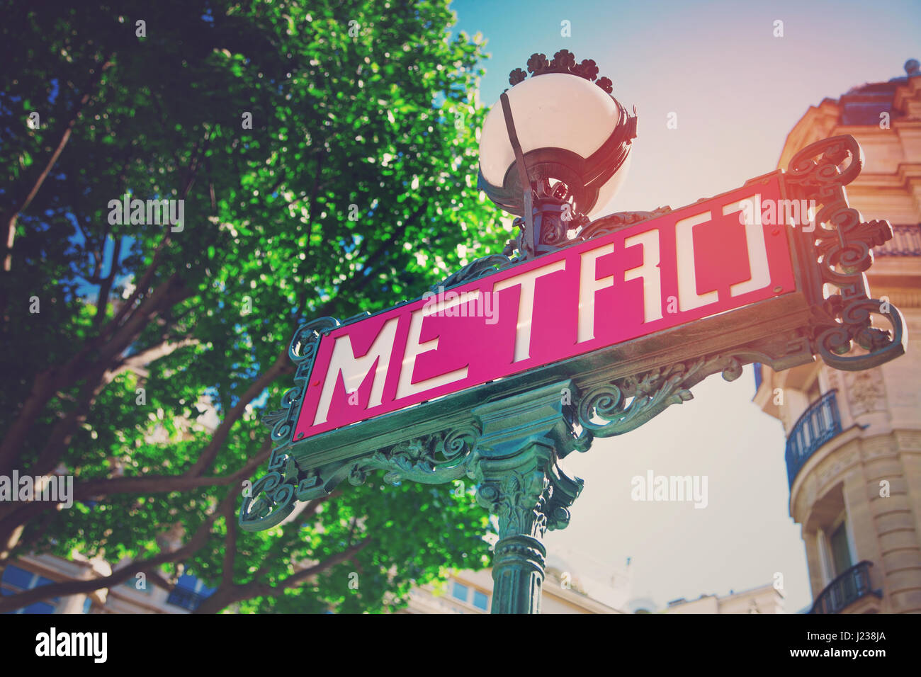 Traditional Paris metro sign with trees in the background Stock Photo ...