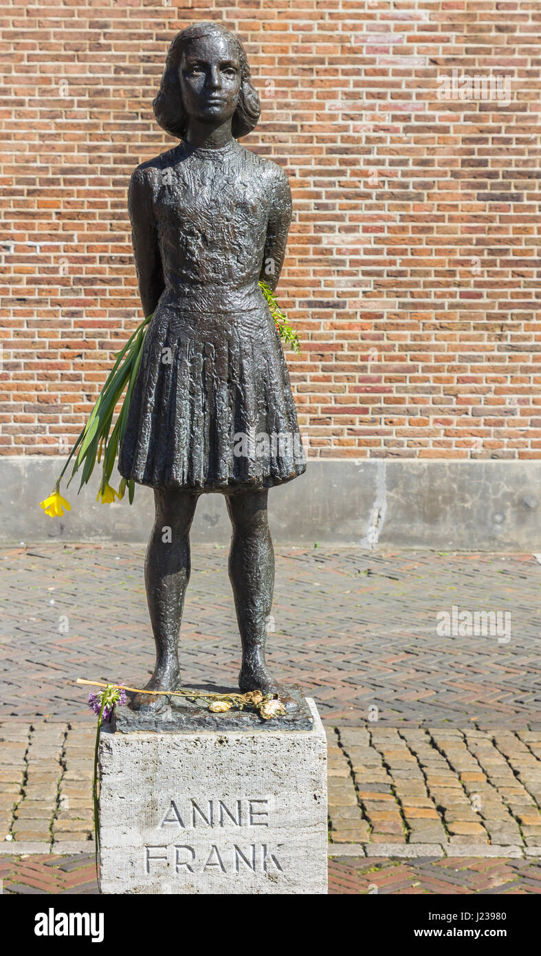 Statue of Anne Frank holding flowers in Utrecht, Netherlands Stock ...