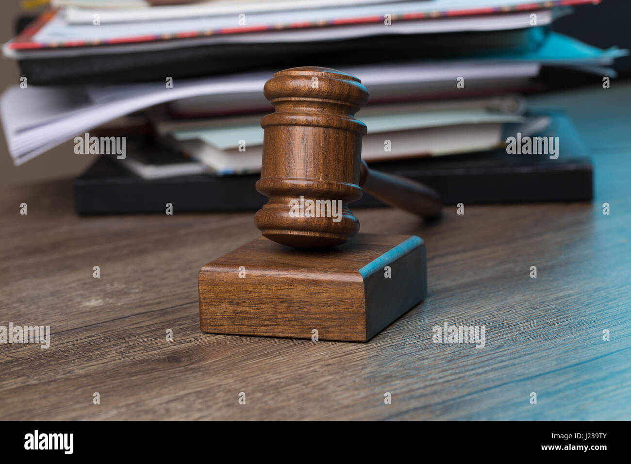 Wooden table with hammer judge Stock Photo - Alamy
