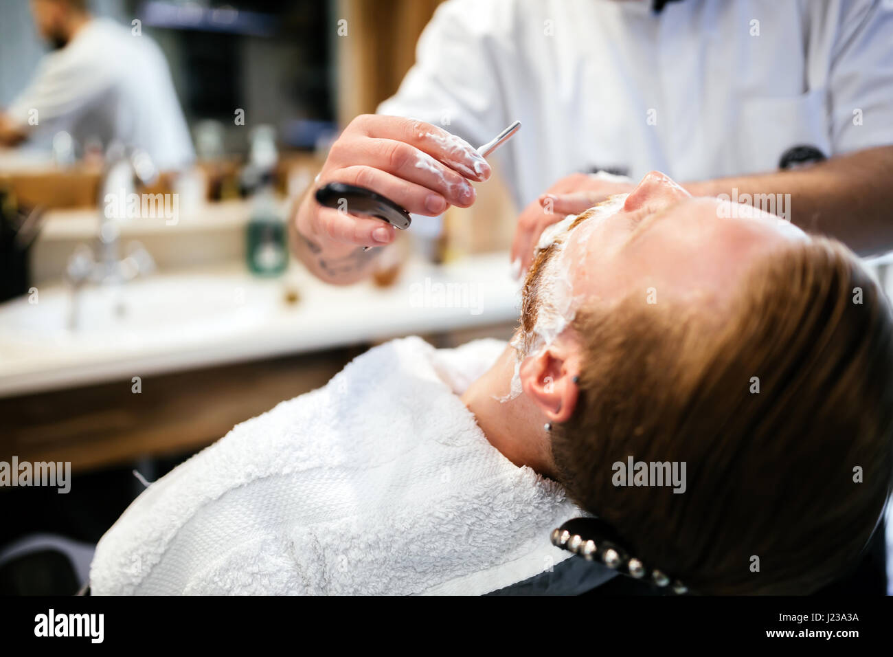 Retro shaving with foam in barber shop Stock Photo - Alamy