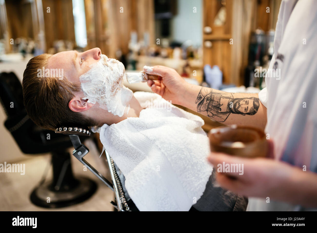 Hair mustache beard treatment in barber shop Stock Photo - Alamy