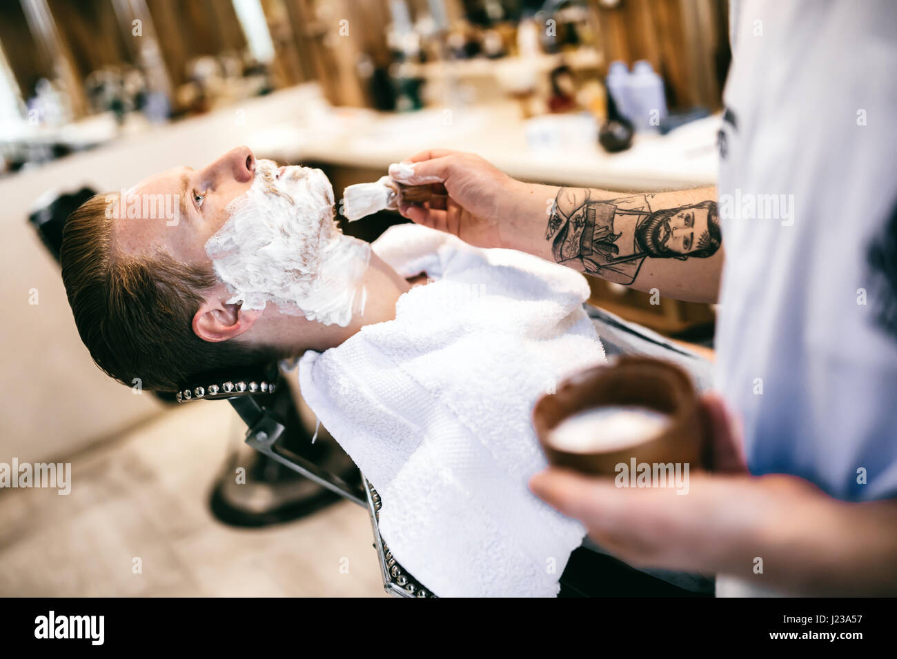 Retro shaving with foam in barber shop Stock Photo - Alamy
