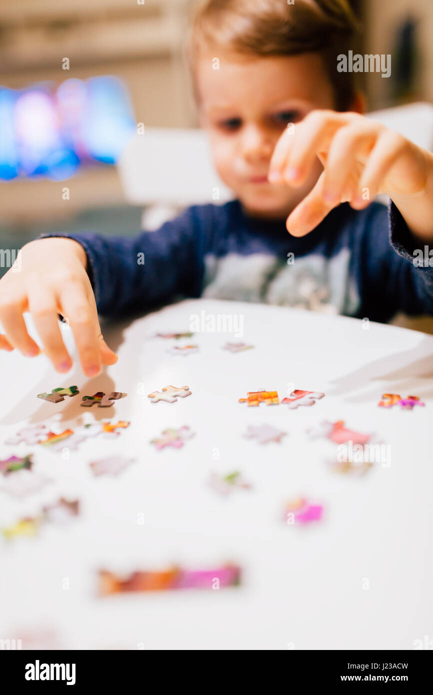 Child concentrating hi-res stock photography and images - Alamy