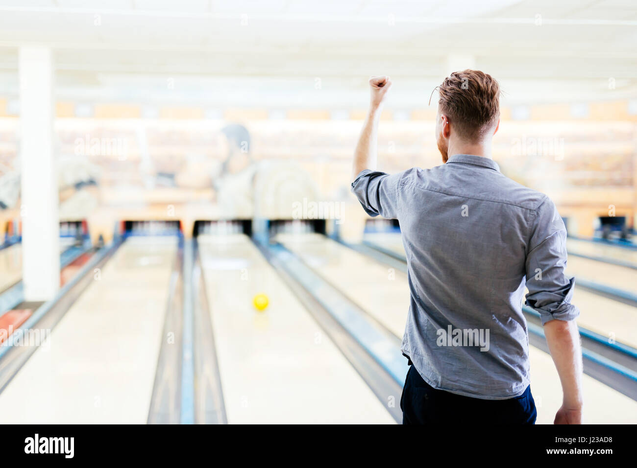 Conceptual image of a winner represented by male raising hand Stock ...