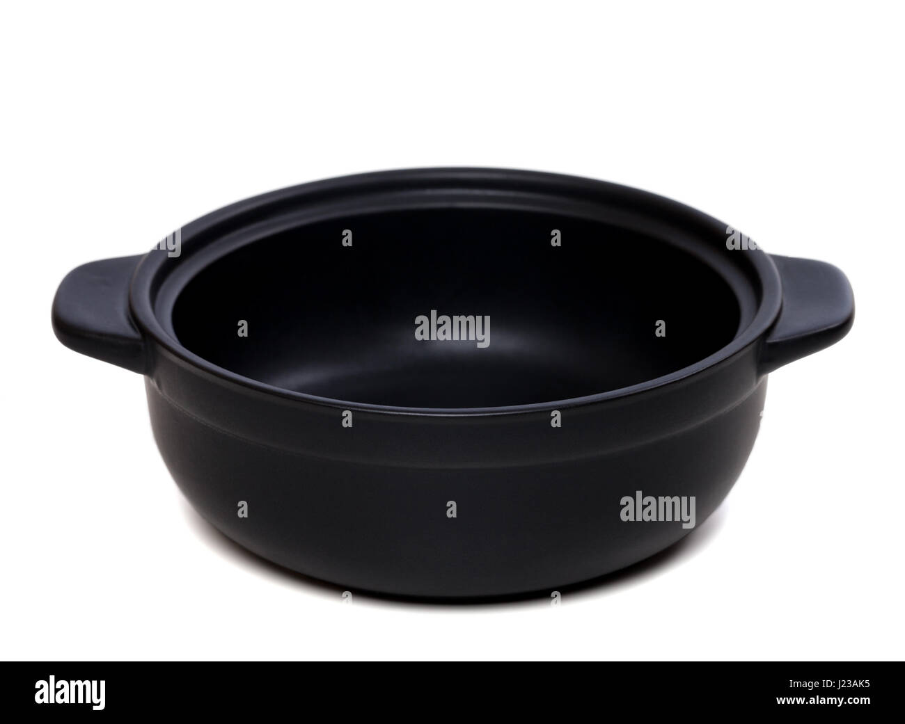 Open black pot for stove. Isolated on white background Stock Photo - Alamy