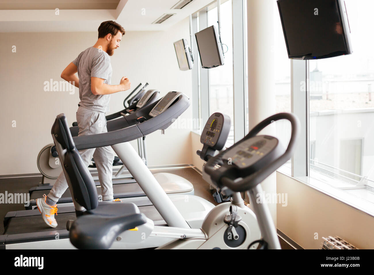 Muscular man running on treadmill hi-res stock photography and images ...