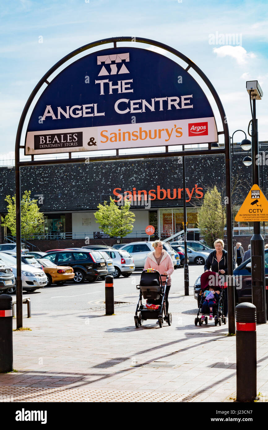 Parents with children in pushchairs leave The Angel Centre, a shopping ...