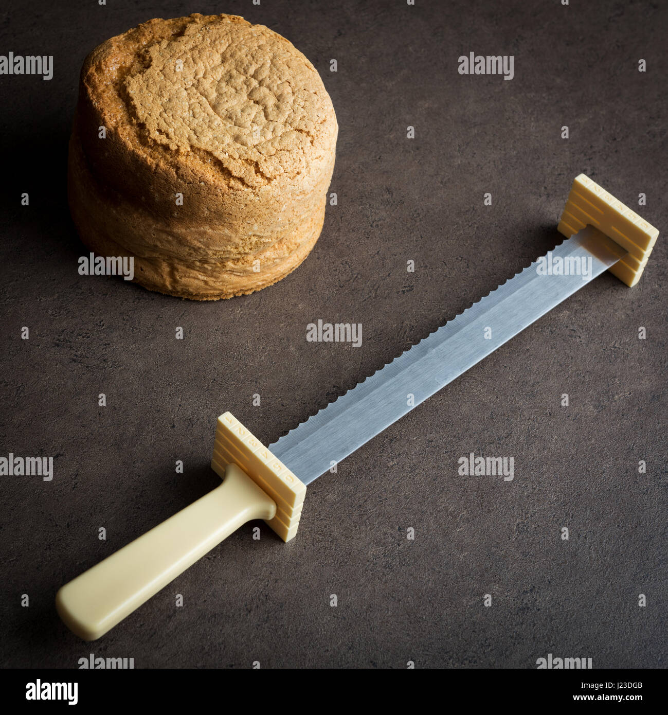 Traditional sponge cake and cake knife on kitchen counter Stock Photo ...