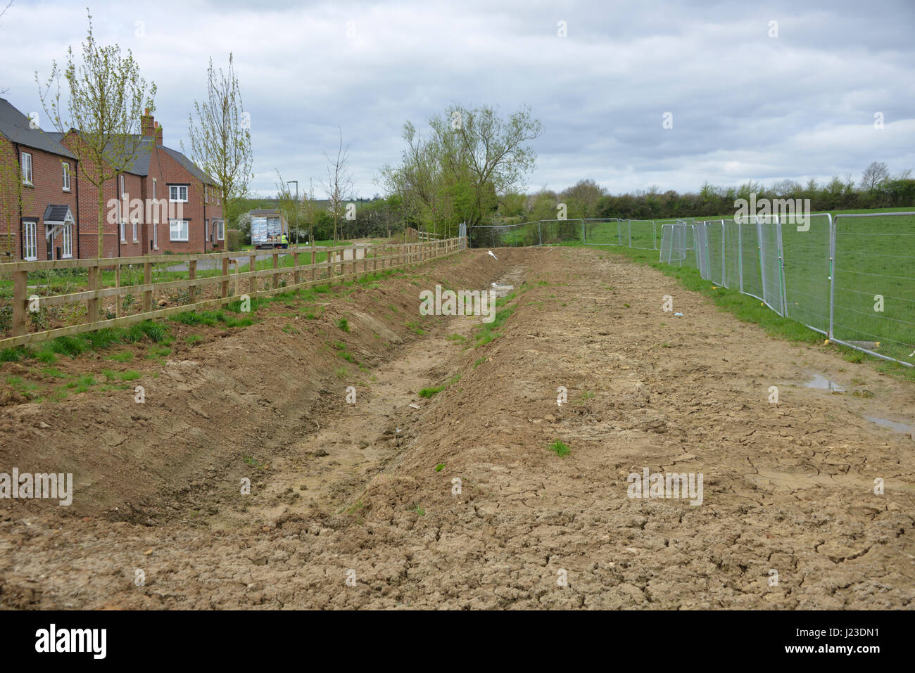Drainage ditch to prevent flooding close to a new housing development ...