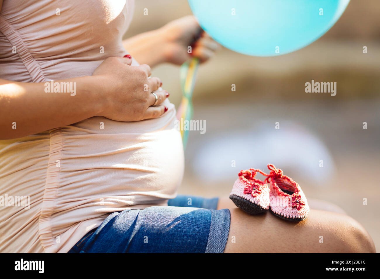Happy pregnant woman expecting a girl Stock Photo - Alamy