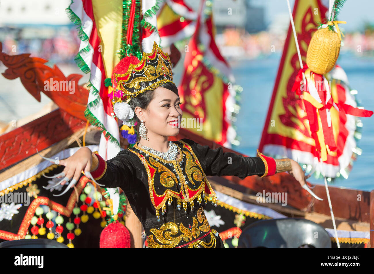 Young girl perform Traditional dance inside the Bajau's boat called ...