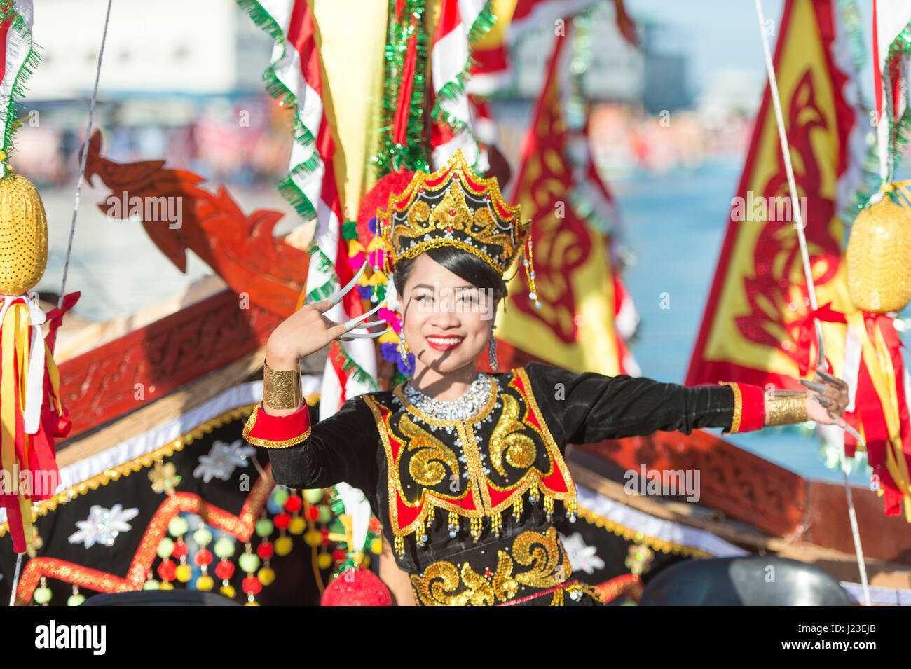 Young girl perform Traditional dance inside the Bajau's boat called ...