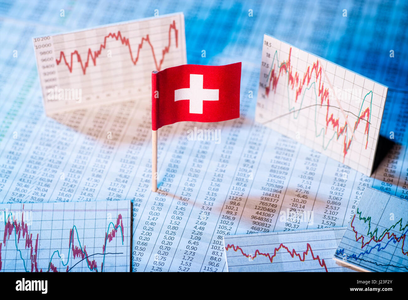 Swiss flag with rate tables and graphs for economic development Stock ...