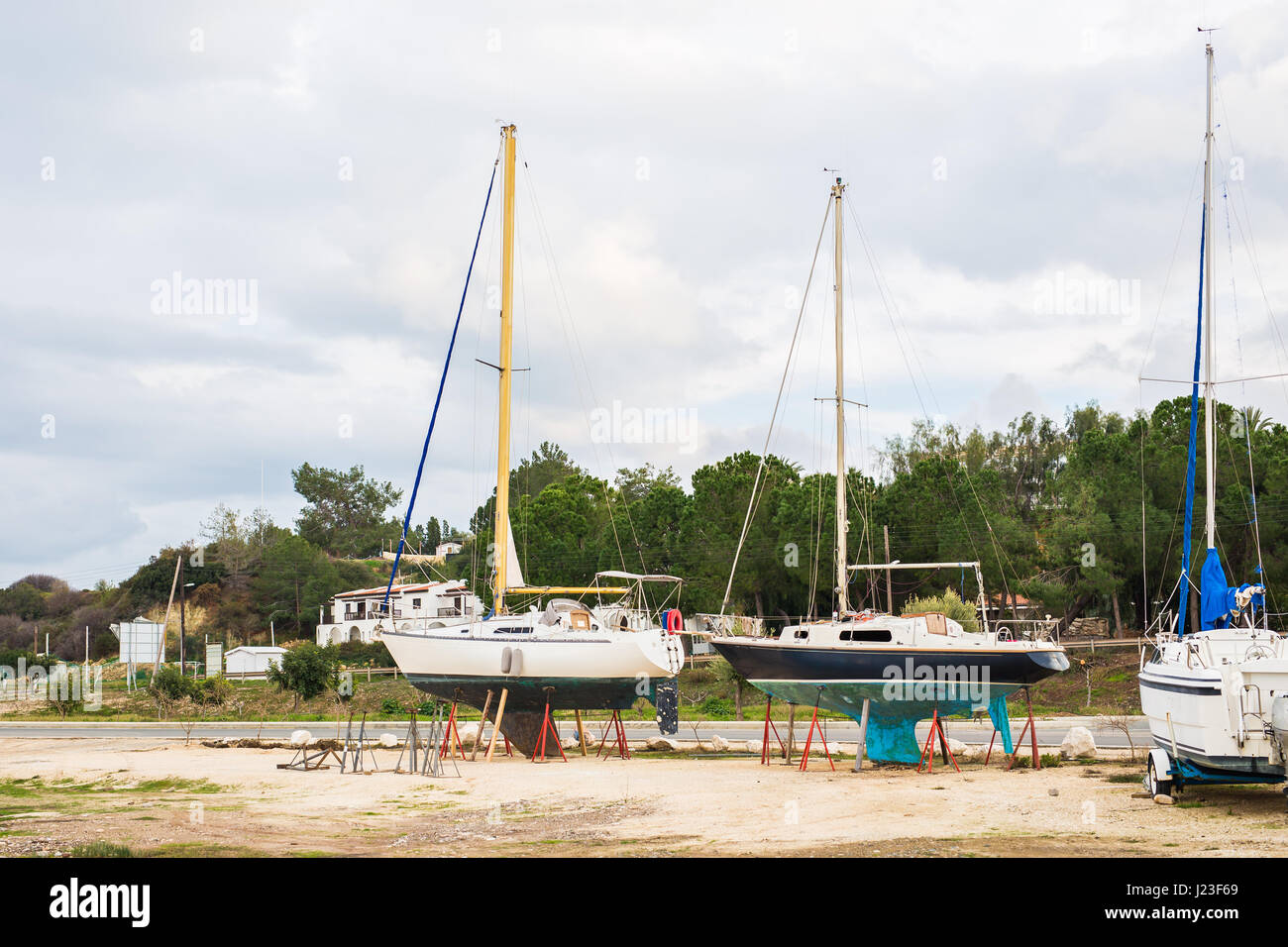 The yachts are aground in shallow sea water. Boat run aground in ...
