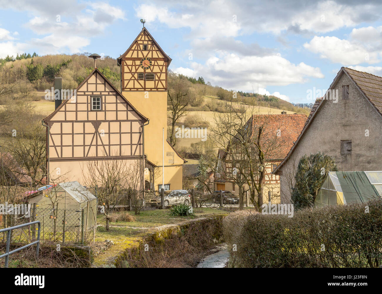 idyllic scenery with historic church in Unterregenbach, a village in ...
