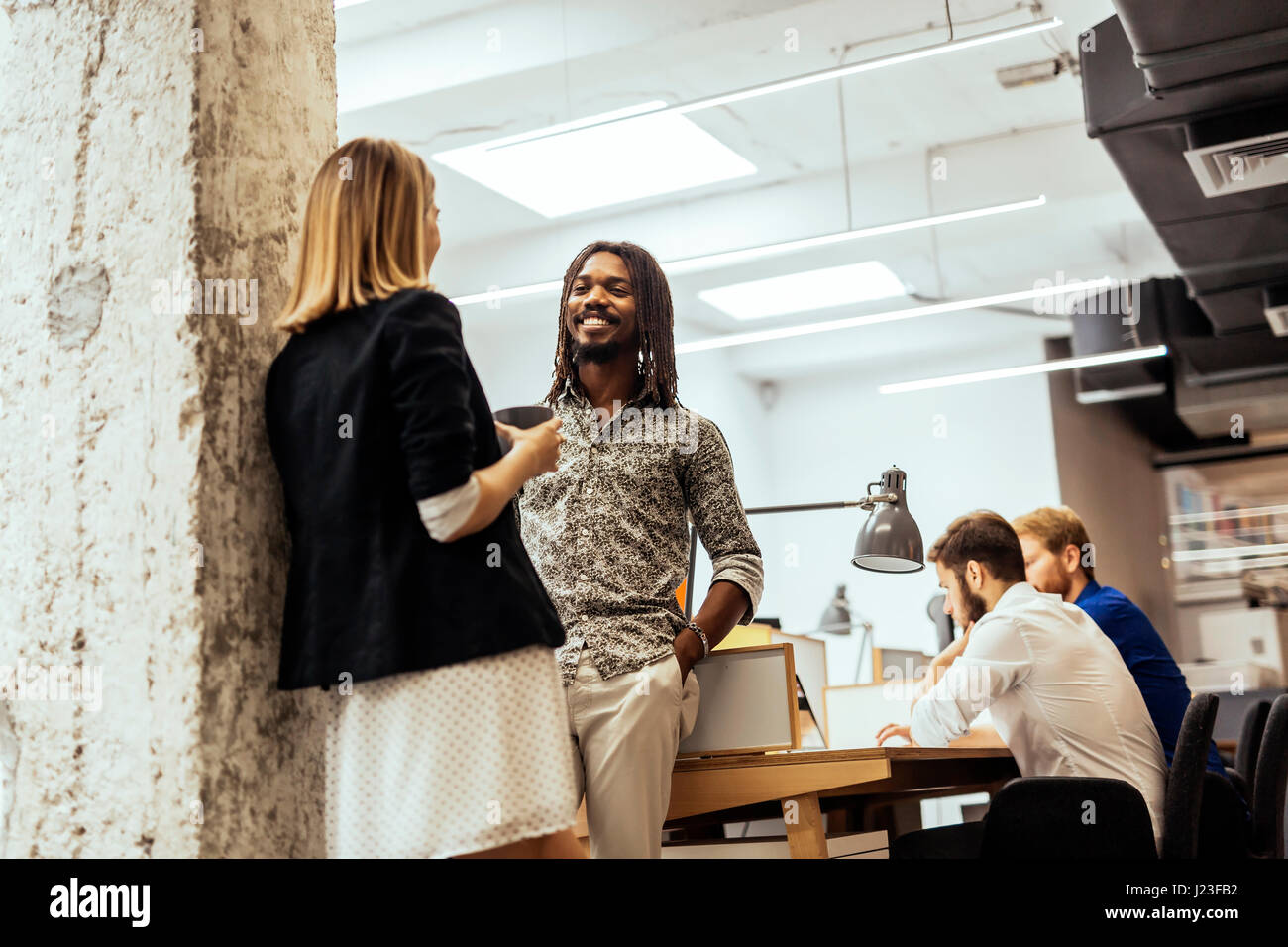 Business colleagues break standing hi-res stock photography and images ...