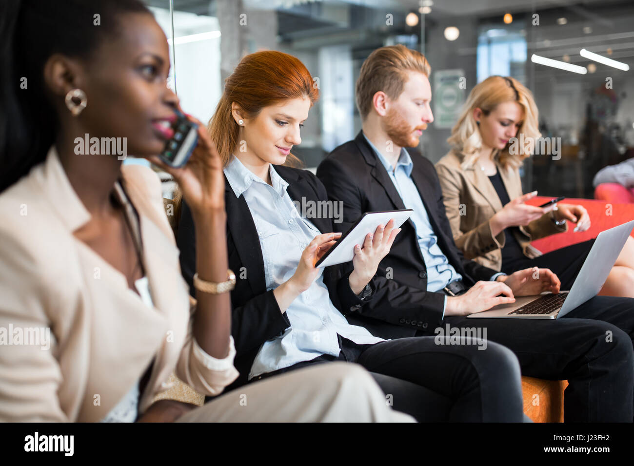 Business people conversation with technology at hand. Exchange of new ...