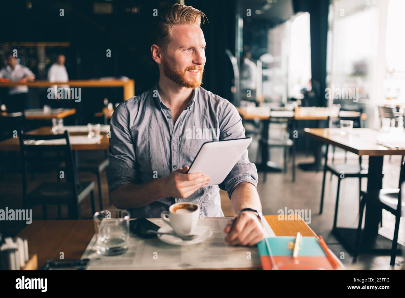 Businessman constantly busy and working Stock Photo - Alamy