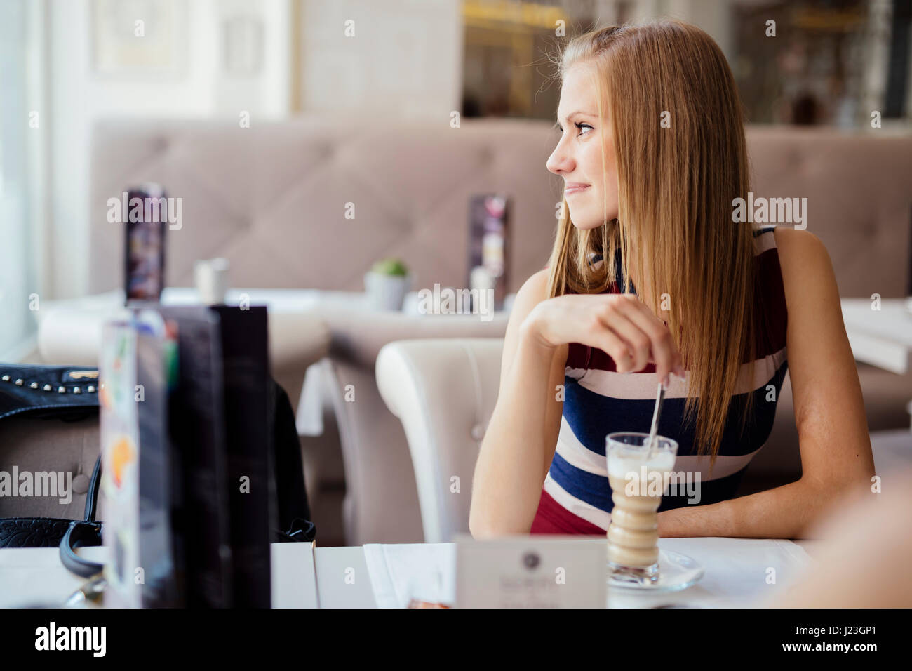 Beautiful woman in cafe hi-res stock photography and images - Alamy
