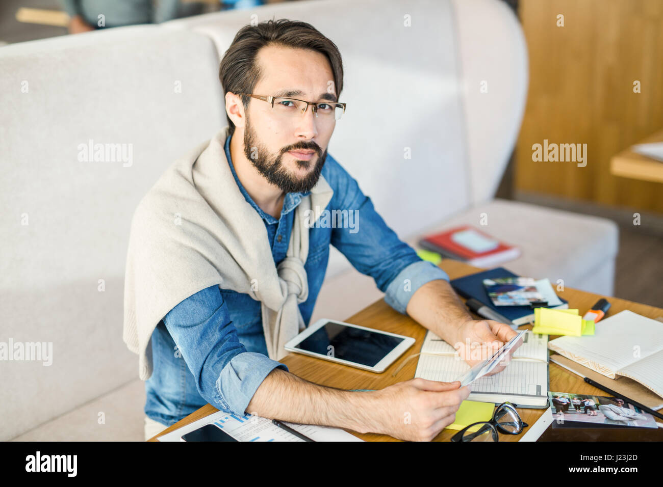 Thoughtful man getting inspired during work Stock Photo - Alamy