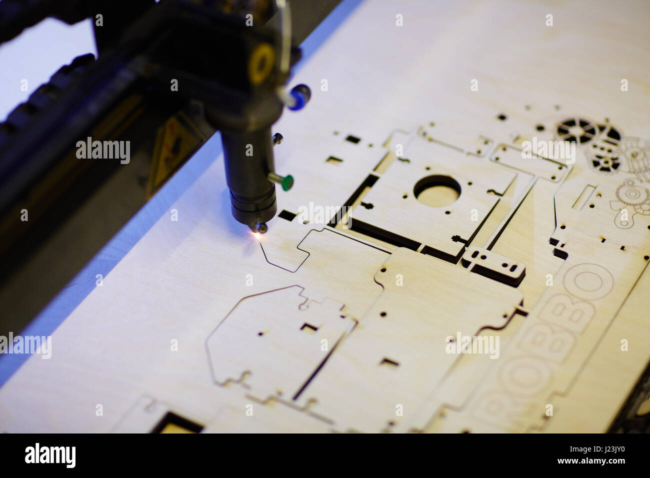 Laser cutter engraving details from veneer wood Stock Photo - Alamy