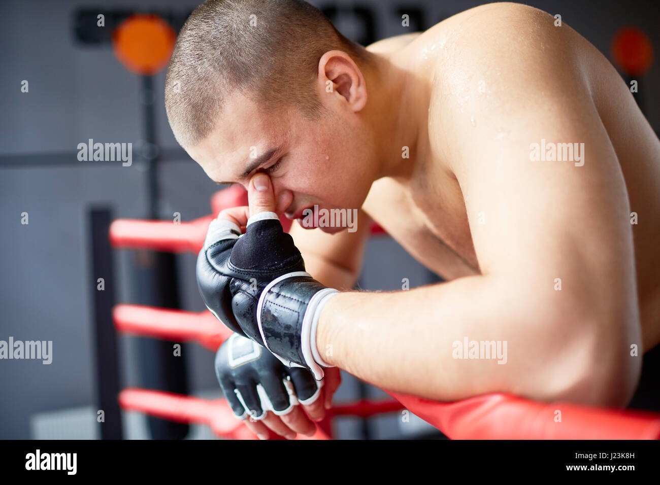 Side view portrait of sweaty exhausted shirtless boxer resting ...