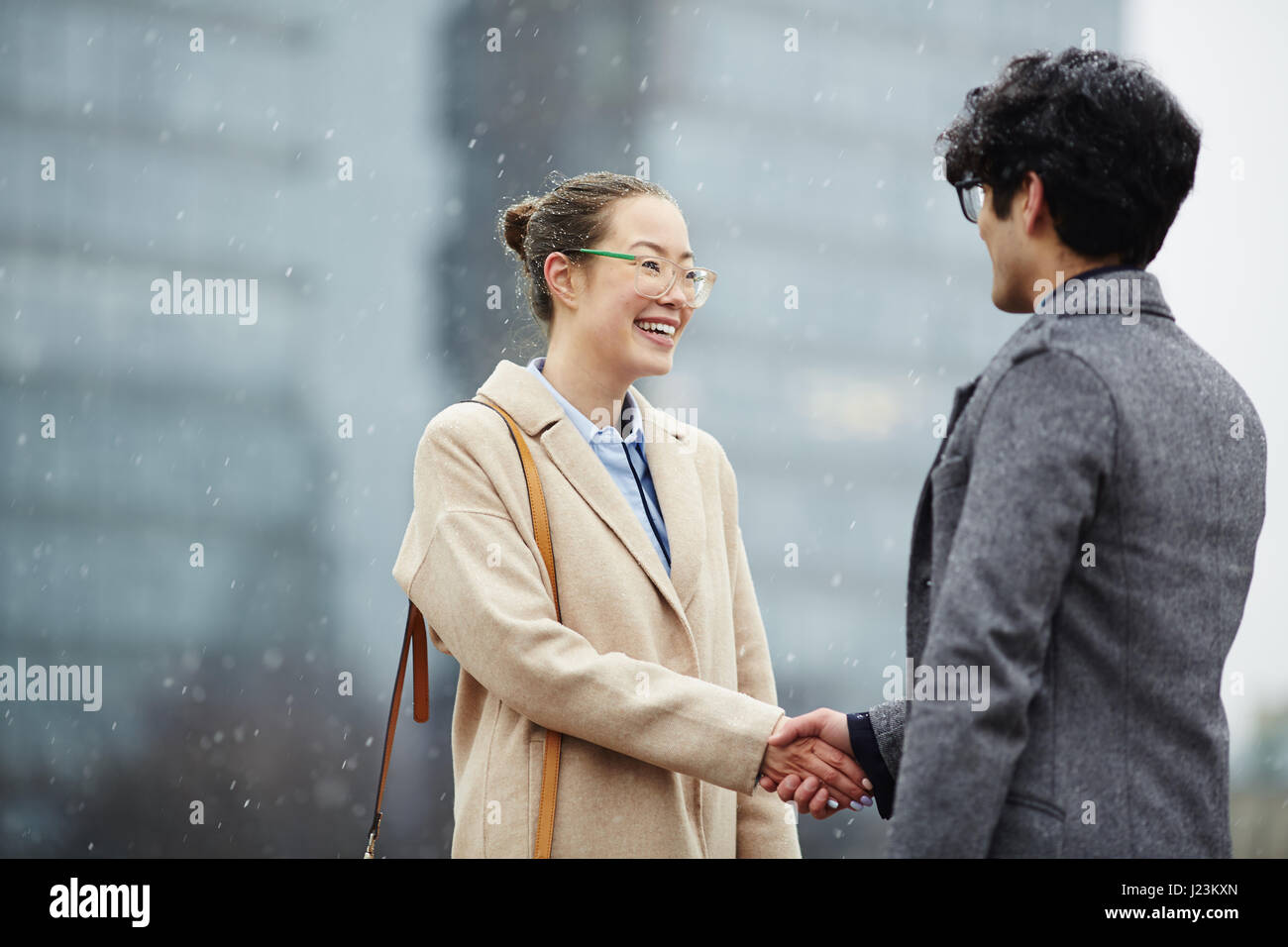 Happy businesswoman introducing herself to partner Stock Photo - Alamy
