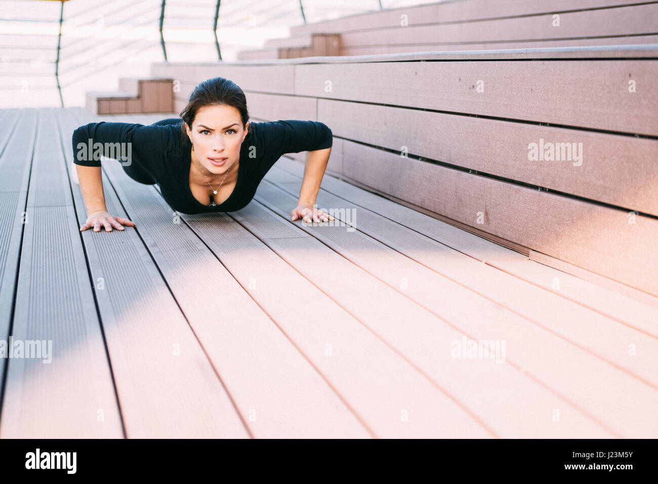 Beautiful Woman Doing Push Ups Stock Photos & Beautiful Woman Doing ...