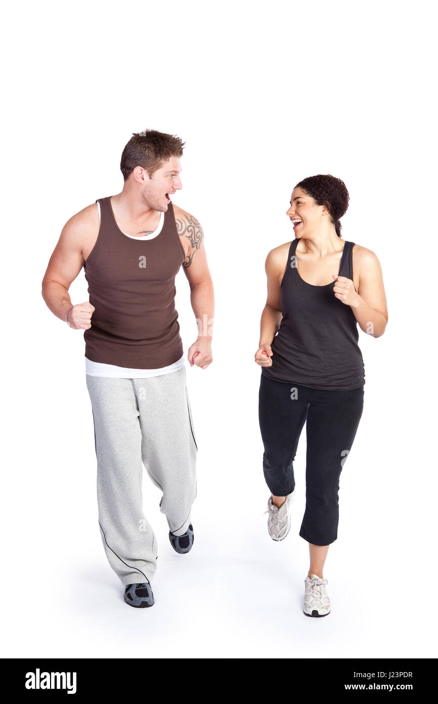 A woman running with her personal trainer Stock Photo - Alamy