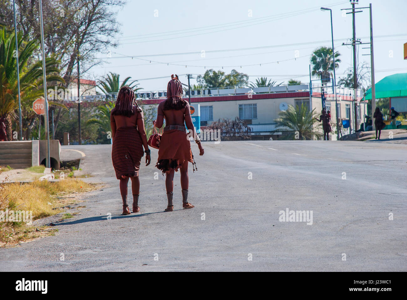 Himba womans in traditional clothes walking on the streets of Outjo ...