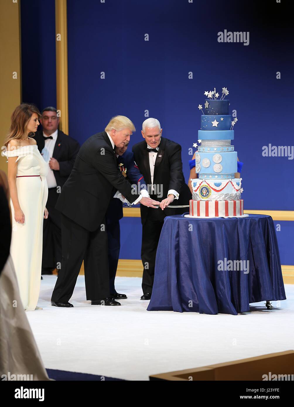 U.S. President Donald Trump and Vice President Mike Pence cut the cake ...