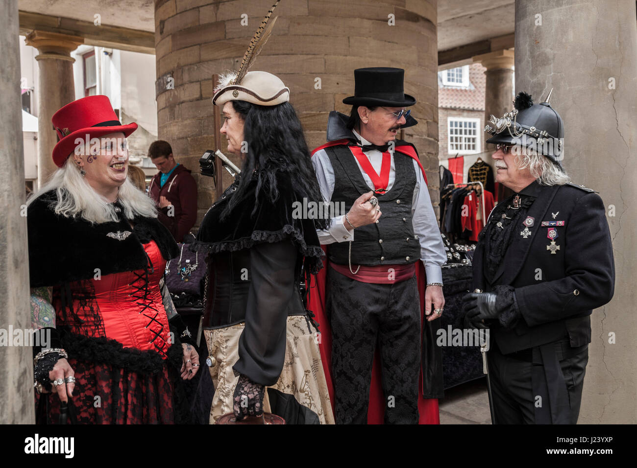 A group of Goths/Steampunks stood chatting at the Goth Weekend ...