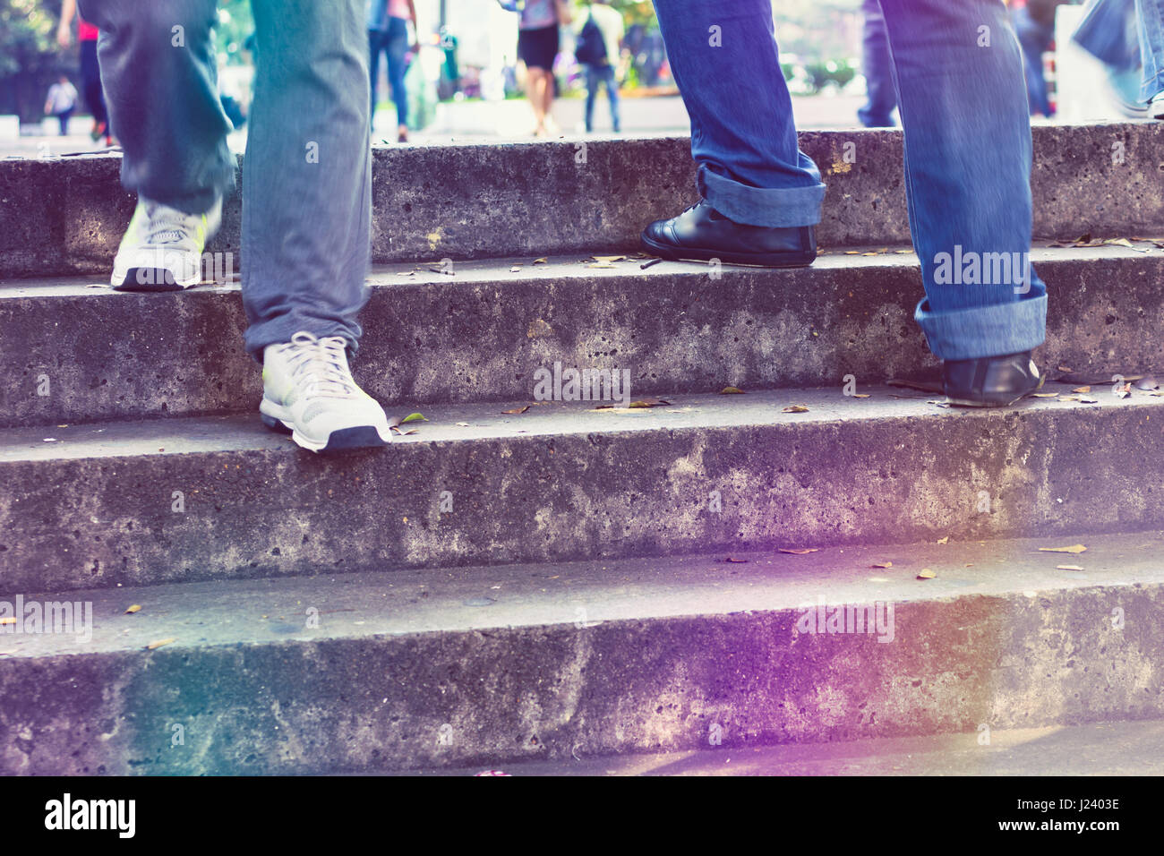 Two people going up the stairs hi-res stock photography and images - Alamy